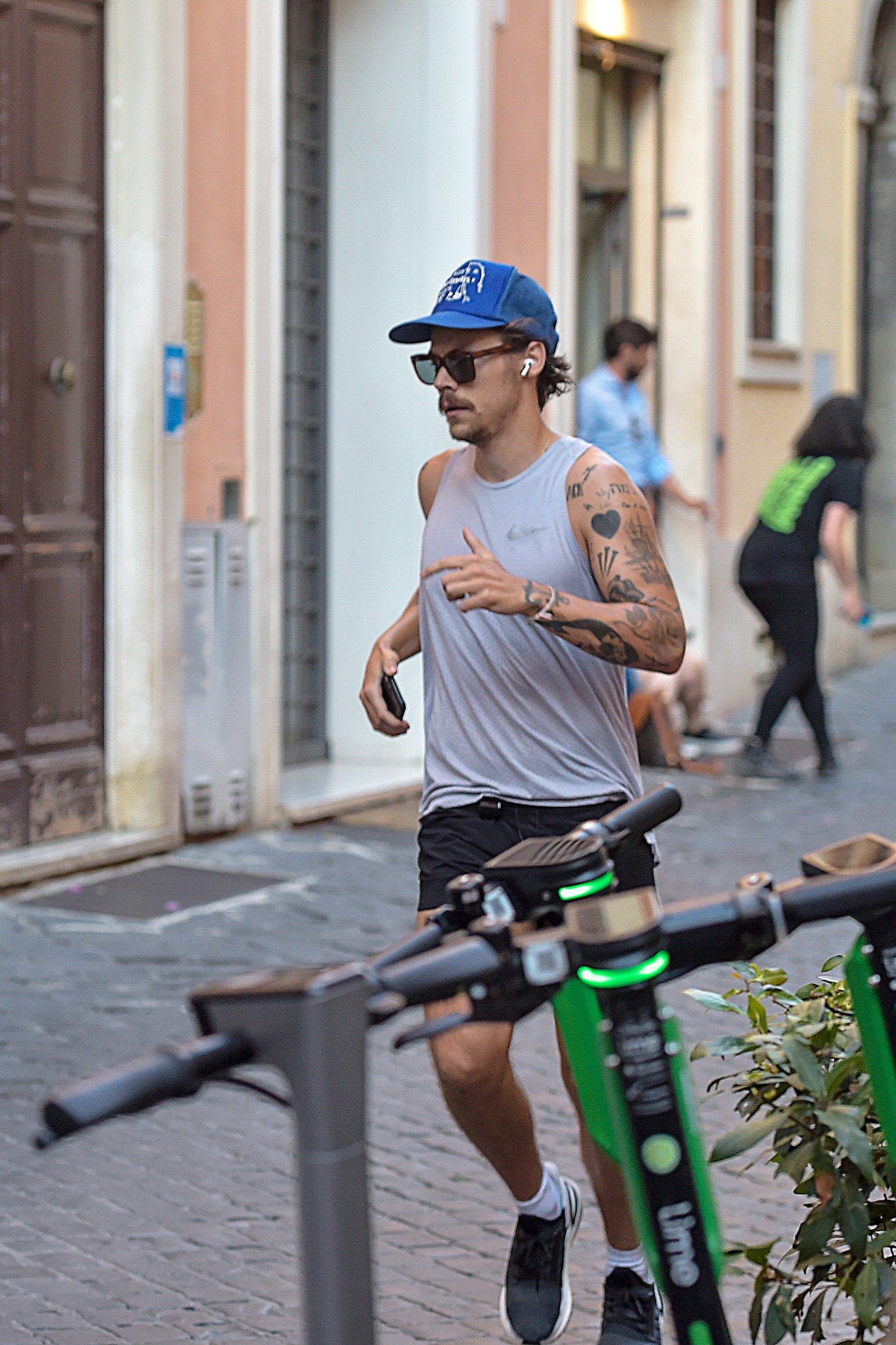 Harry Styles Sports '70s-Inspired Quarantine Mustache in Rome: Pics ...