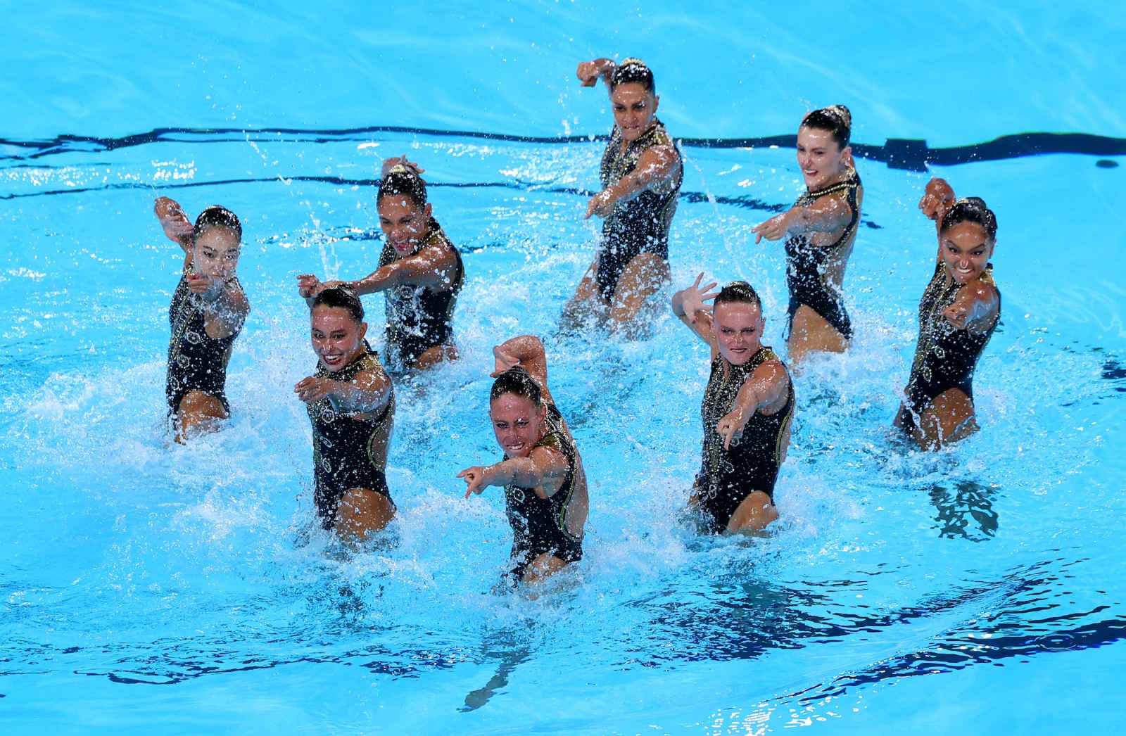 How Do Women Artistic Swimmers Keep Their Makeup on Underwater? | Us Weekly