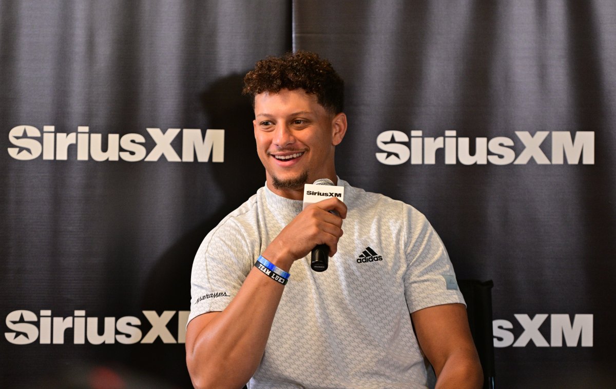 Patrick Mahomes Signs Footballs for Kids at Training Camp | Us Weekly