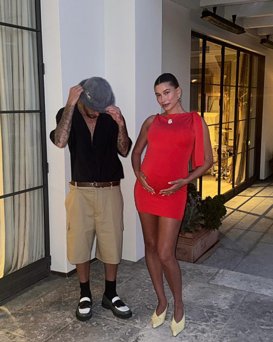 Pregnant Hailey Bieber Cradles Her Baby Bump in Ruby Frock With Justin ...
