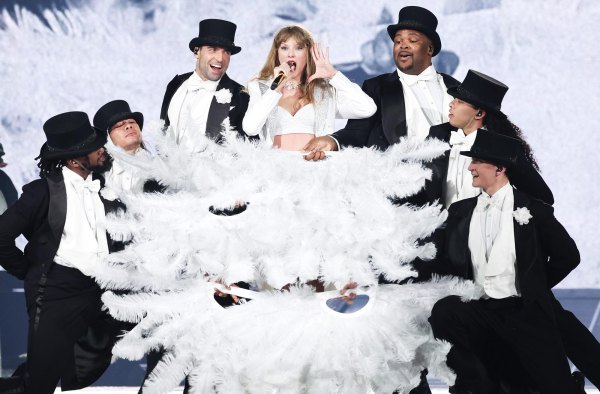 Taylor Swift's 'Eras Tour' Dancer Kam Saunders Falls on Stage | Us Weekly