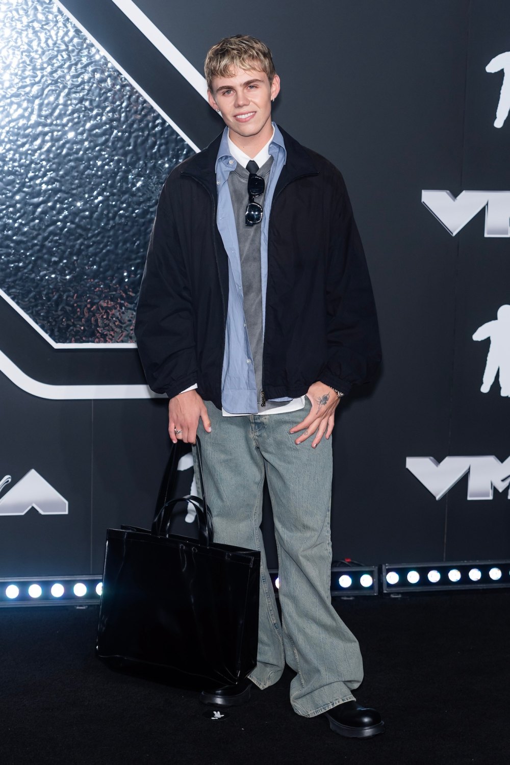 Celebrities Who Rock Man Bags: Harry Styles, ASAP Rocky, More | Us Weekly