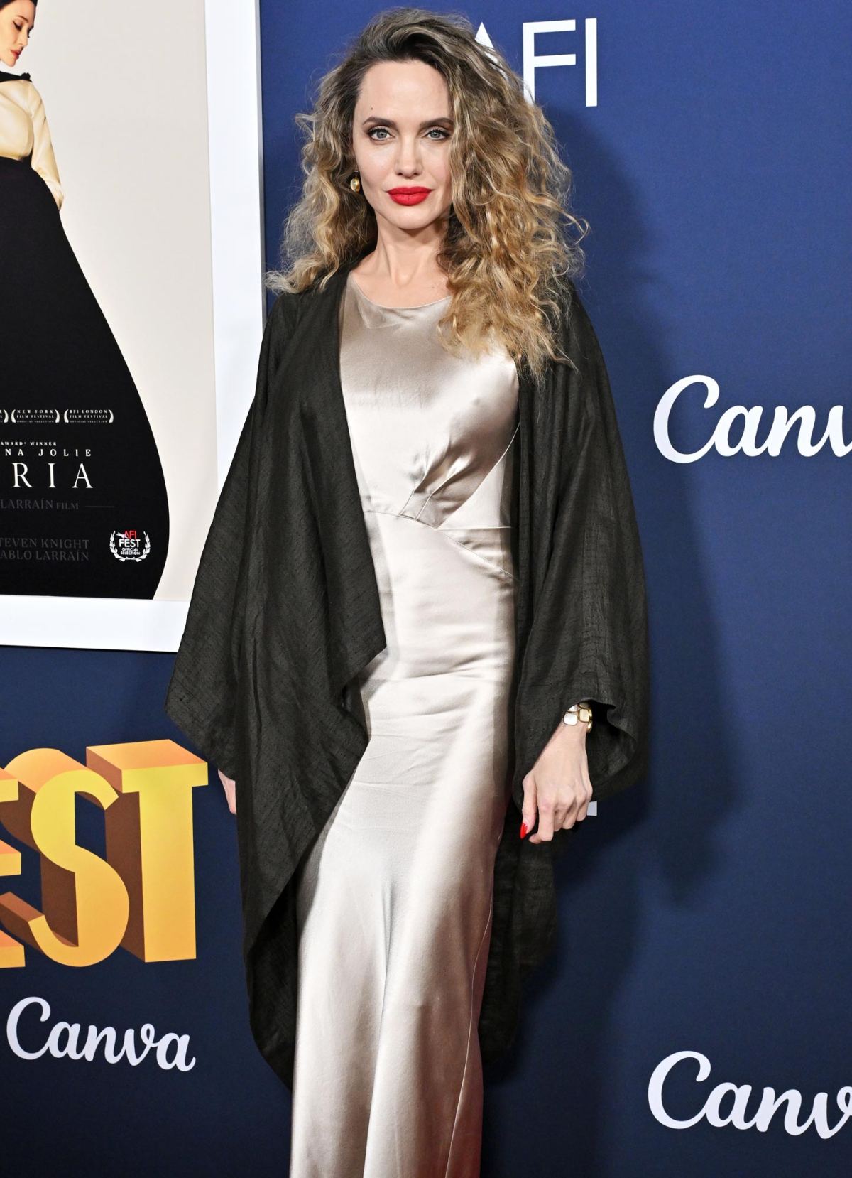 Angelina Jolie Stuns in Red Carpet Curls for New Film, 'Maria' | Us Weekly