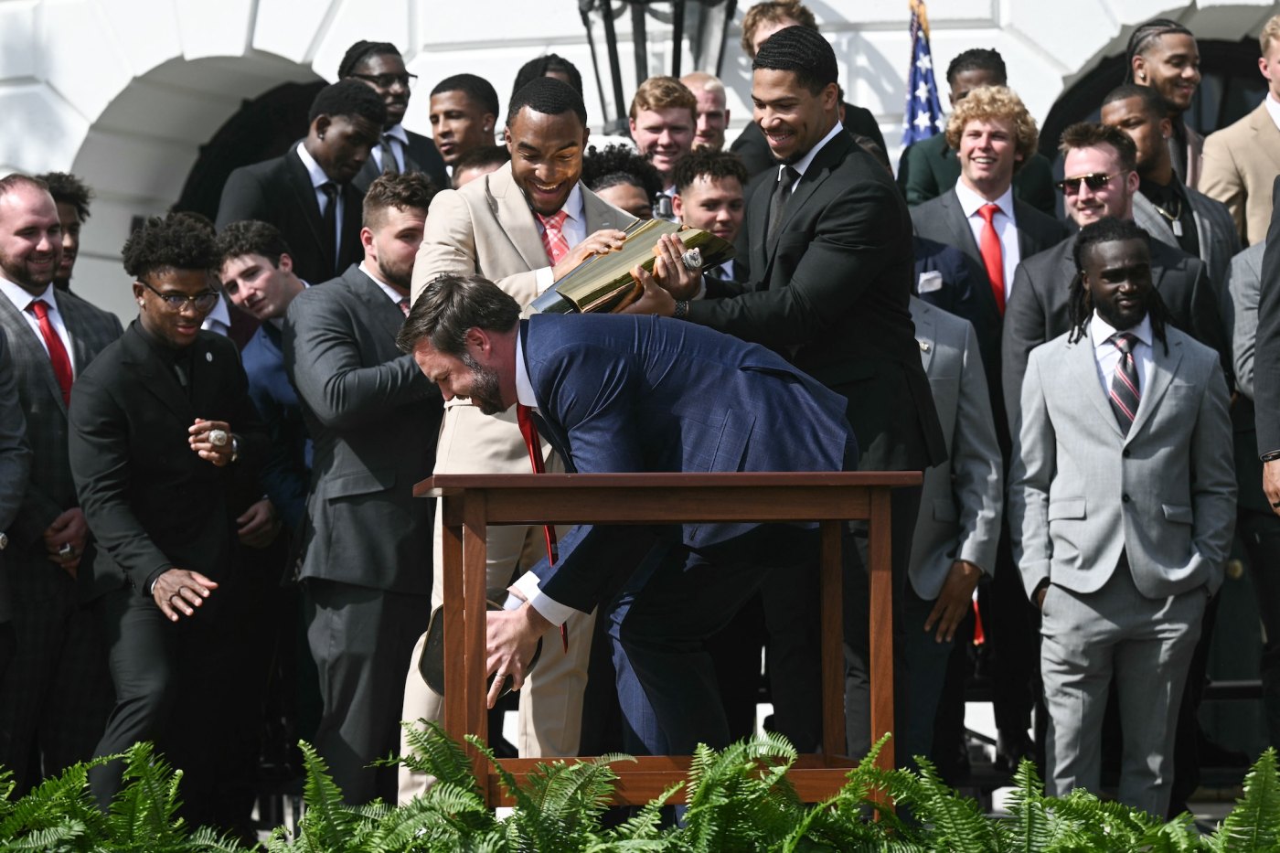 JD Vance Breaks Ohio State Trophy at White House Celebration | Us Weekly