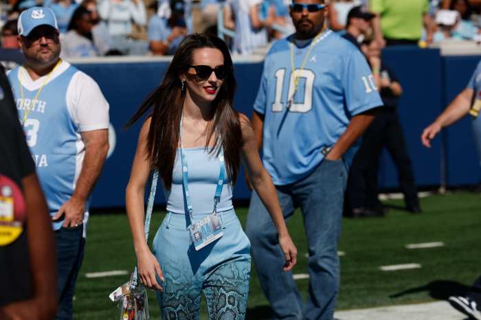 Jordon Hudson Supports Bill Belichick in Blue Top and Flared Pants | Us ...