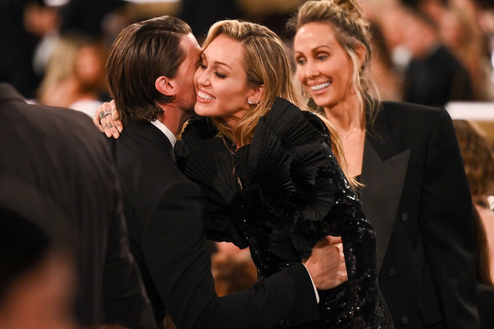 Miley Cyrus, Patrick Schwarzenegger Share Kiss on Cheek at Golden ...
