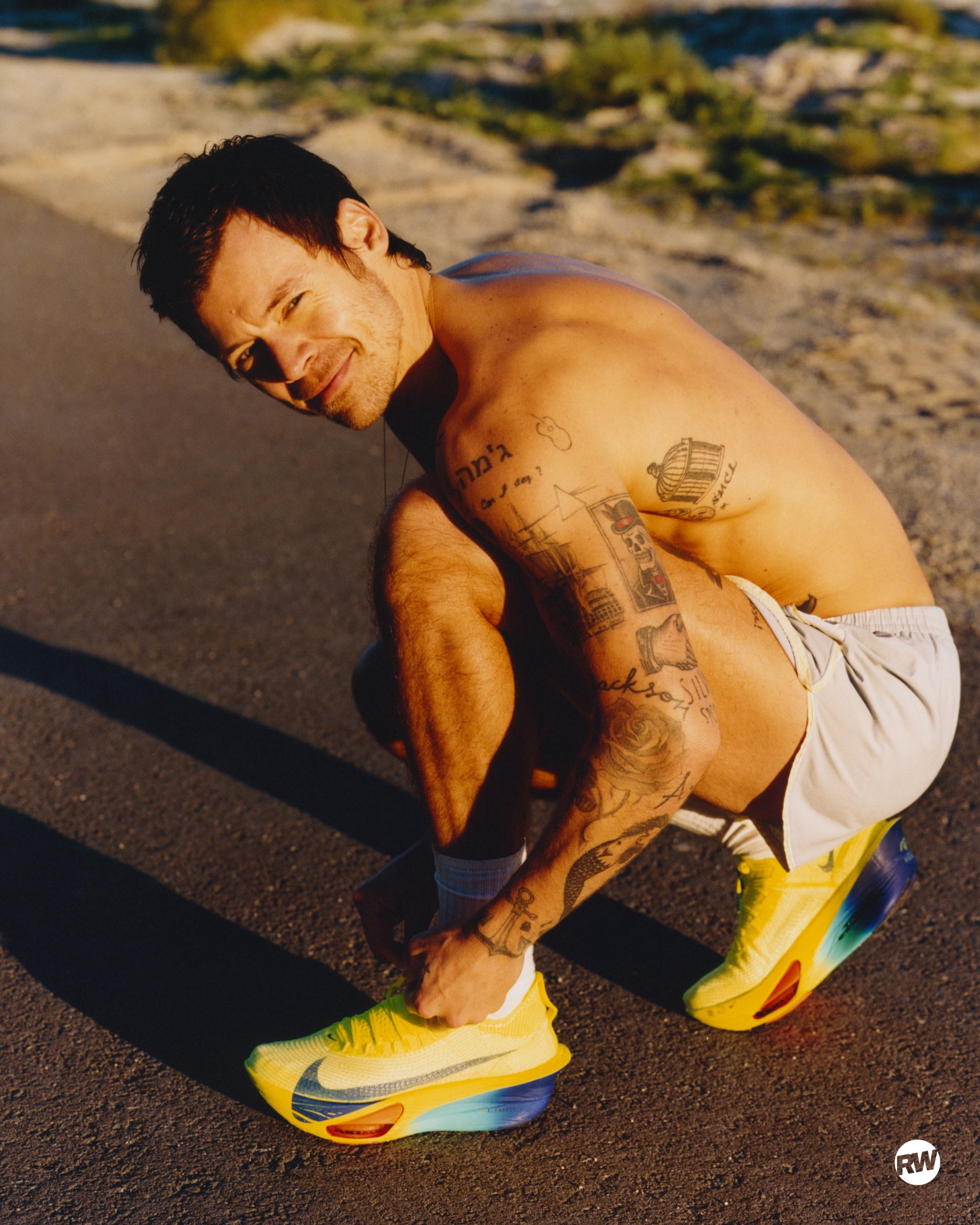 Harry Styles Goes Shirtless for Runner's World, Talks Marathon | Us Weekly