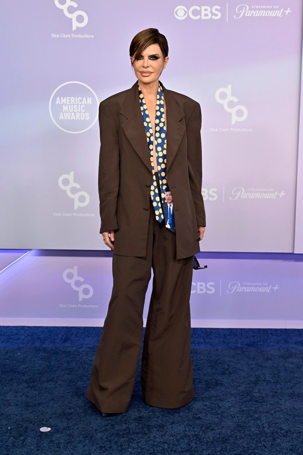 Lisa Rinna Goes Topless, Wears Tie With Husband Harry Hamlin