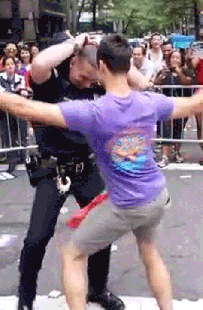 NYPD Officer Dances With Pride Paradegoer: GIFs | Us Weekly