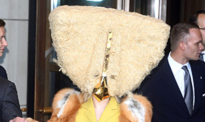 Lady Gaga Dresses Like a Chicken in Giant Furry Mask, Yellow Dress
