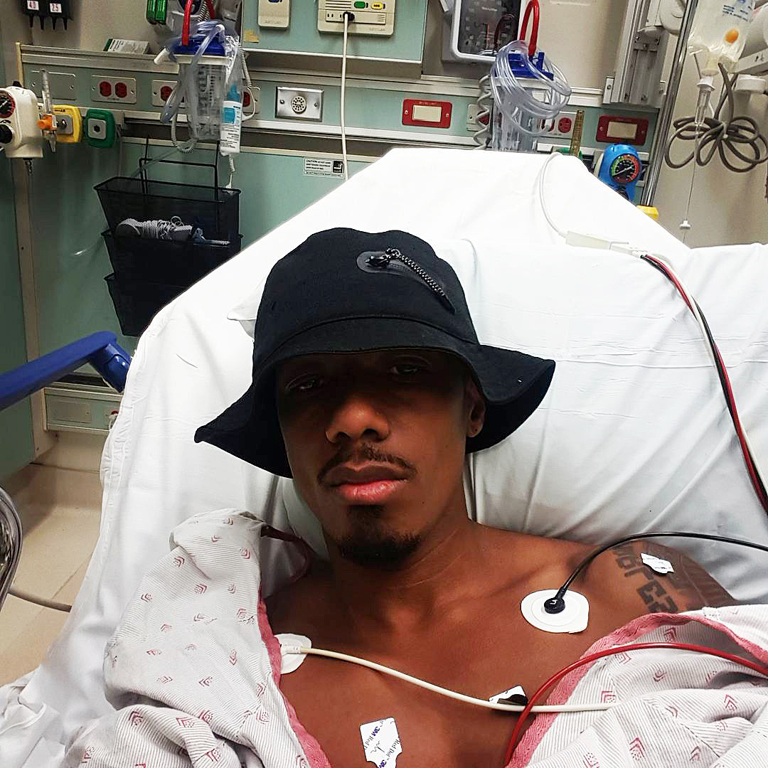 Nick Cannon Hospitalized, Takes Selfie Wearing Bucket Hat: "#ImGood"