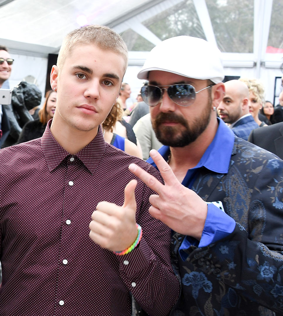 Justin Bieber Celebrates Dad’s Engagement Party, Pets Tiger | Us Weekly