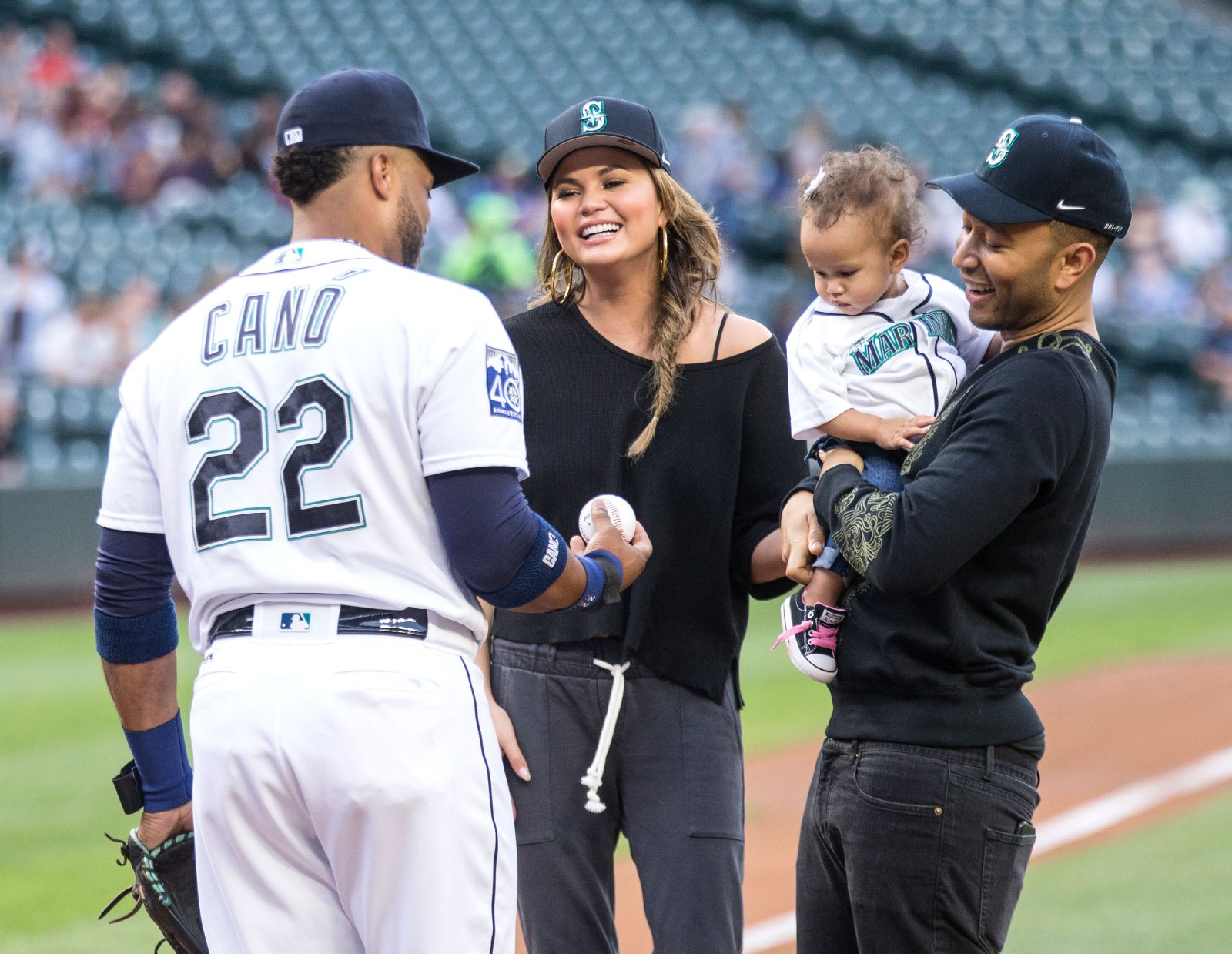 Chrissy Teigen, John Legend's Daughter Luna Throws First Pitch | Us Weekly